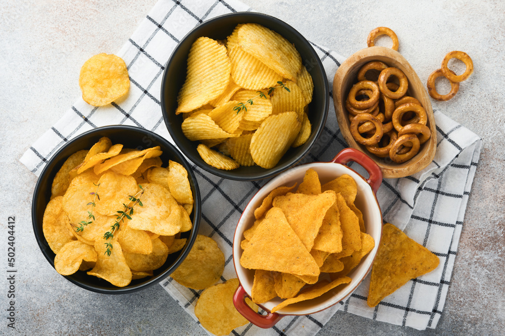 Snacks. Unhealthy food. All classic potato snacks with peanuts, popcorn ...