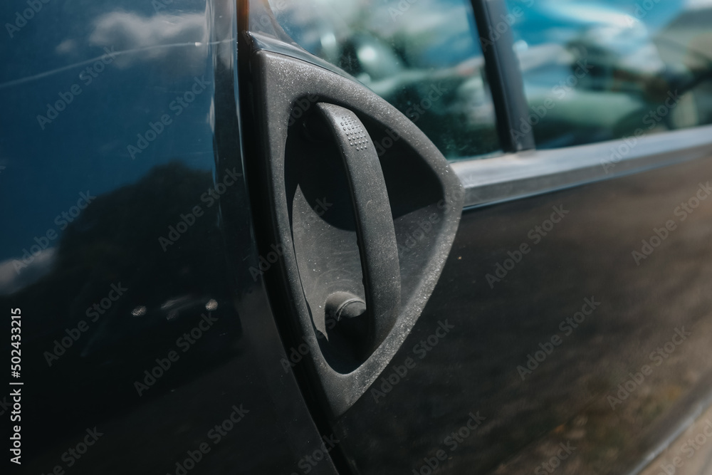 Handle of an automatic sliding door of a black van Stock Photo | Adobe ...