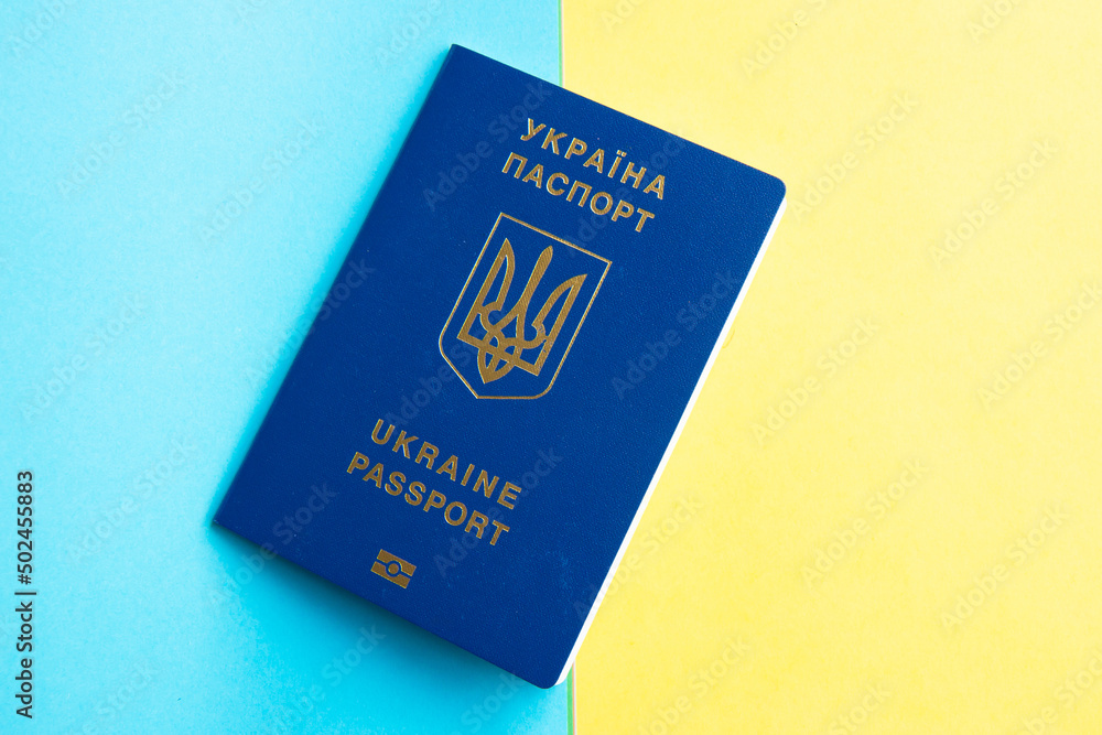 Passport of a citizen of Ukraine on a blue and yellow background ...