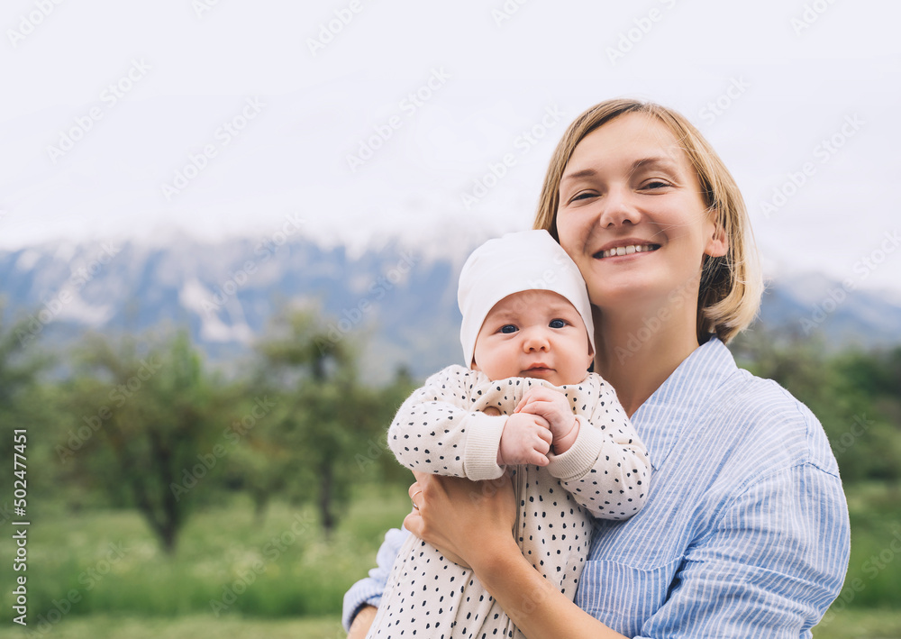 Mother and baby walking on nature outdoors. Family in green nature ...