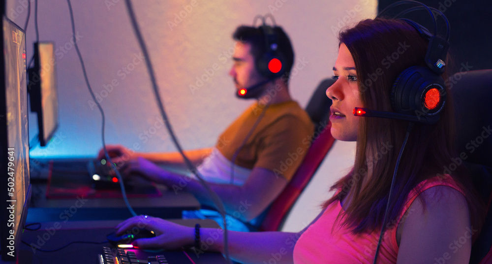 Team of gamers playing computer games at night Stock Photo | Adobe Stock