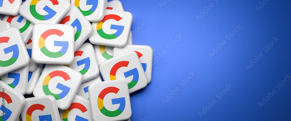 Foto de Logos of the company Google / Alphabet on a heap on a table ...