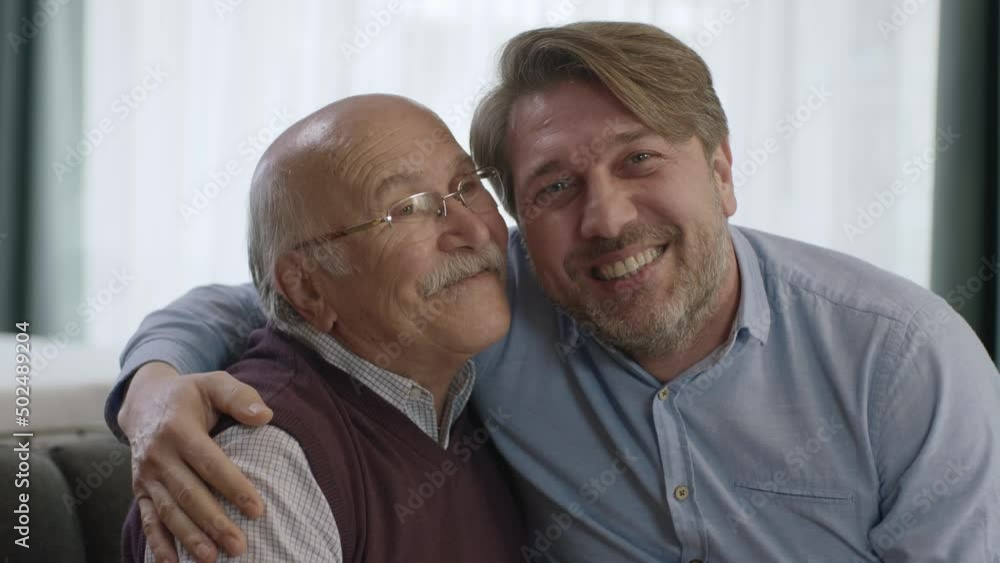 The man who comes to visit his father hugs the old man.The old man and ...