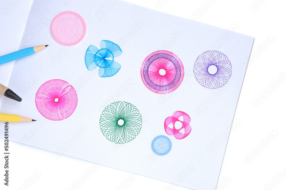 Spirograph ruler on white background. Drawing the spirograph pattern on ...