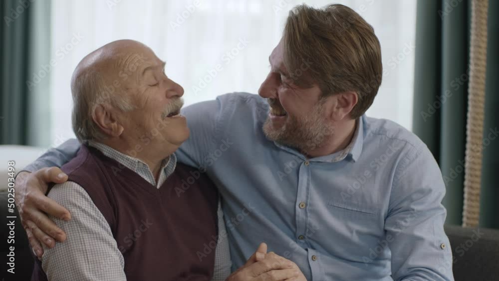 The young man is happy to see his father come to visit.The old man and ...