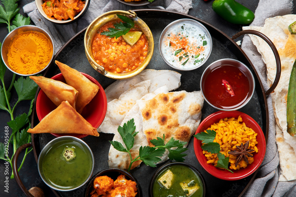 Indian Thali on dark background. Stock Photo | Adobe Stock