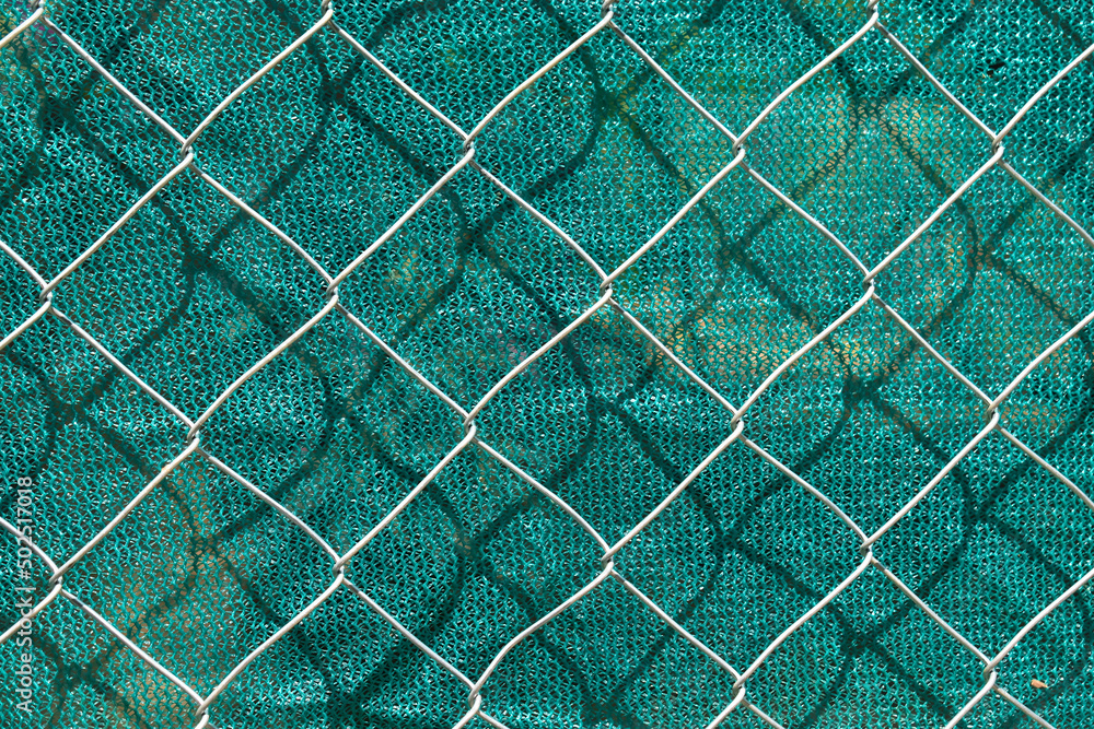 Wire fence or metal net in morning light with shade. texture background ...