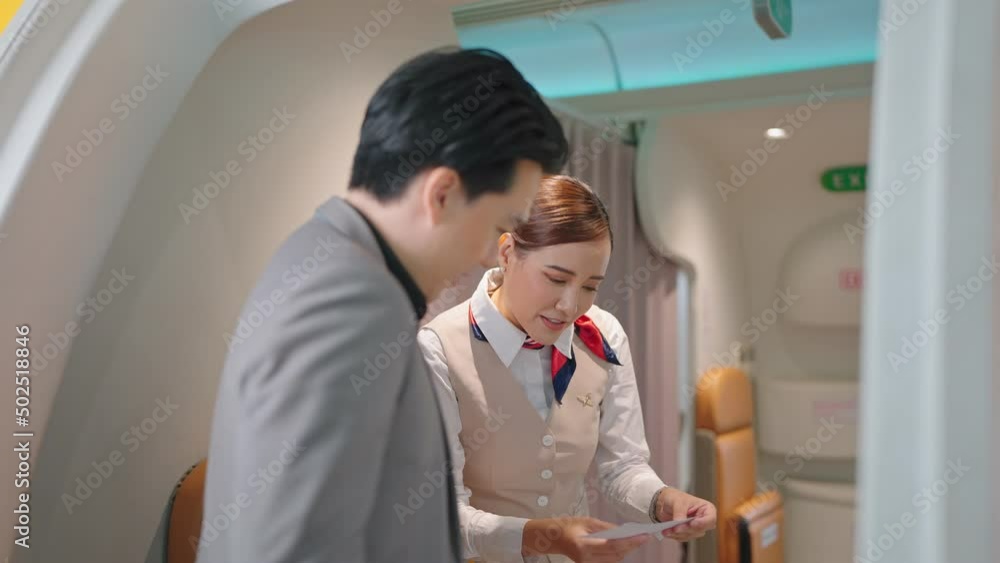 Passengers boarding the plane with boarding pass checked by flight ...