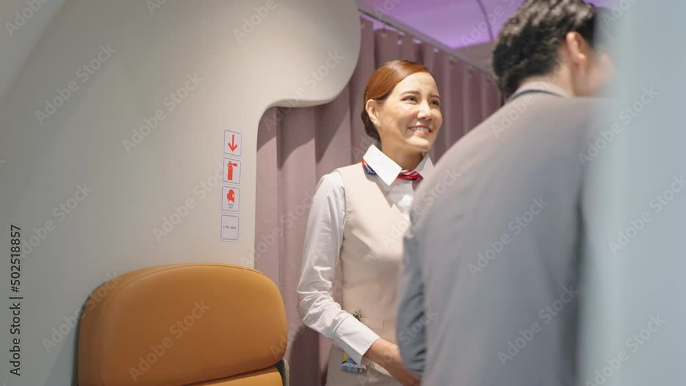 Passengers boarding the plane with boarding pass checked by flight ...