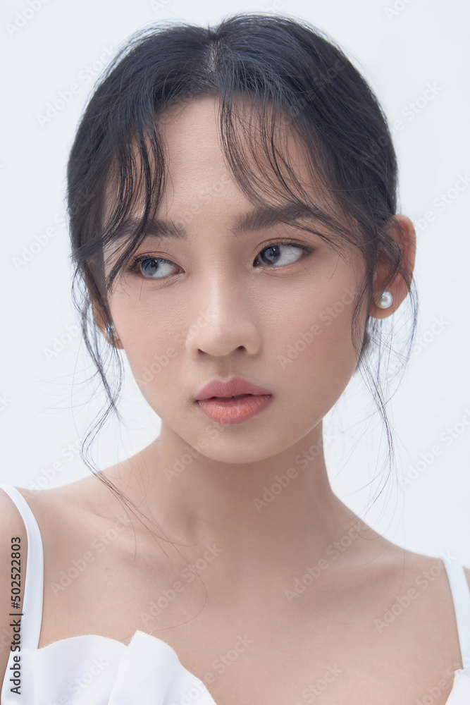 Beauty portrait of Asian female face with natural skin on white ...