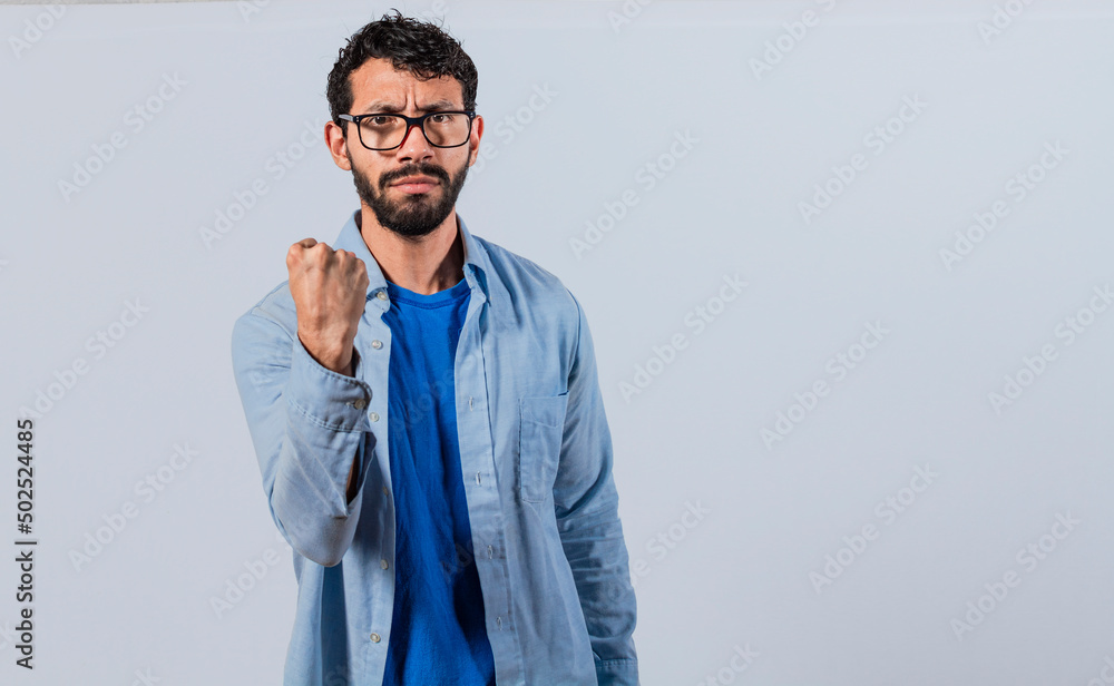 Angry glasses man, annoyed man showing his fist, angry man showing fist ...