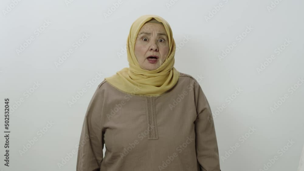 Confused senior woman in hijab surprised to see 70s old woman on camera ...