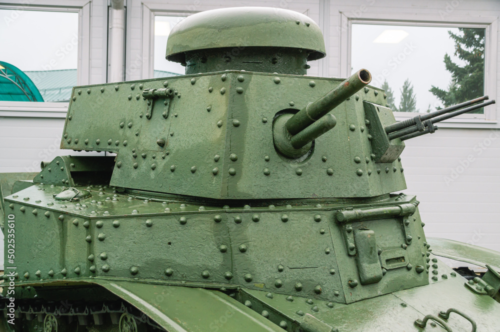 The tower of an old tank with a gun. Old armored vehicles. Tracked tank ...
