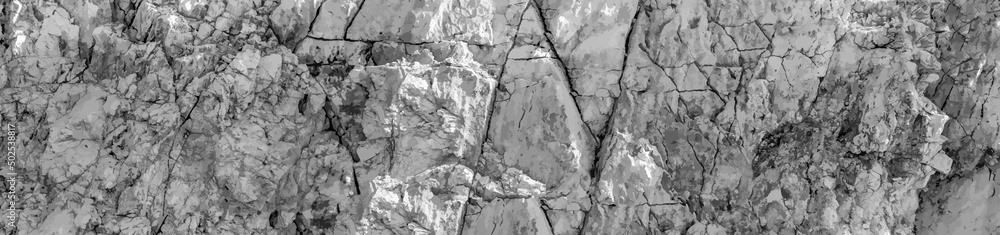 Grungy cragged bumpy pitted cavity stone facade, split layer gap.Ruined ...