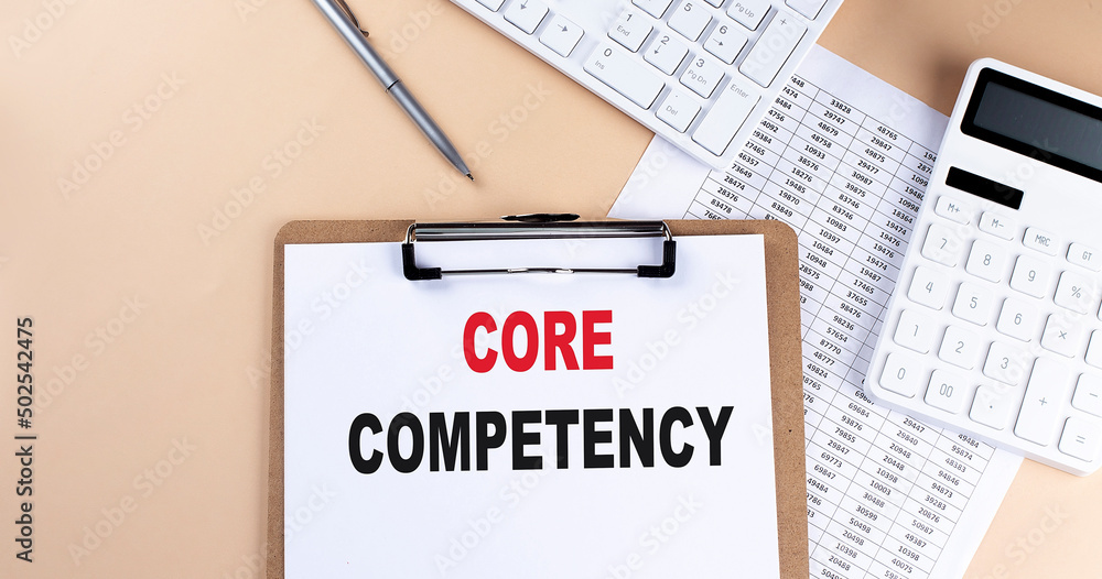 clipboard with white blank paper text CORE COMPETENCY , keyboard ...