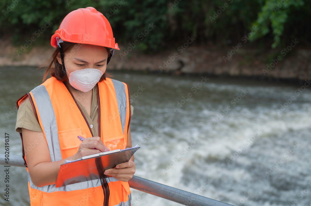 Asian Female engineering working . at sewage treatment plant,Marine ...