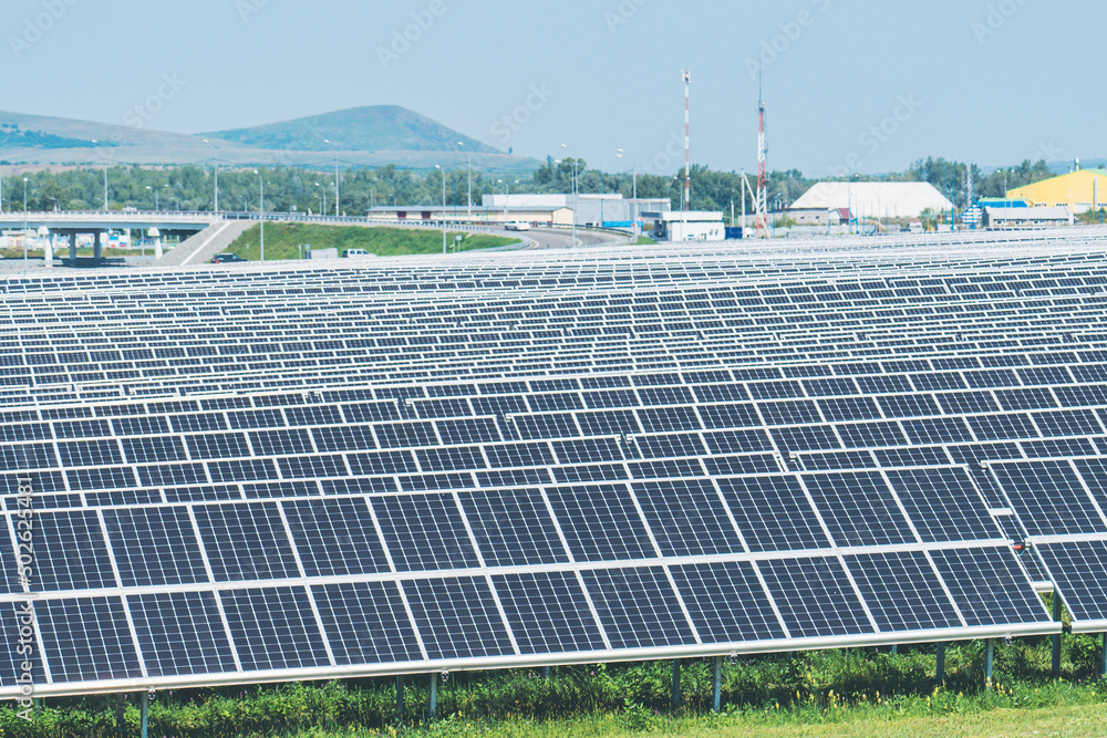 solar-powered power plant, solar module panels on the sky background ...