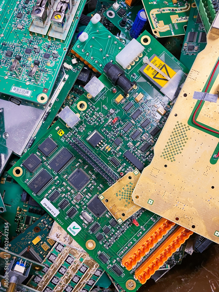 Computer printed circuit boards in a heap, showing gold plating Stock ...