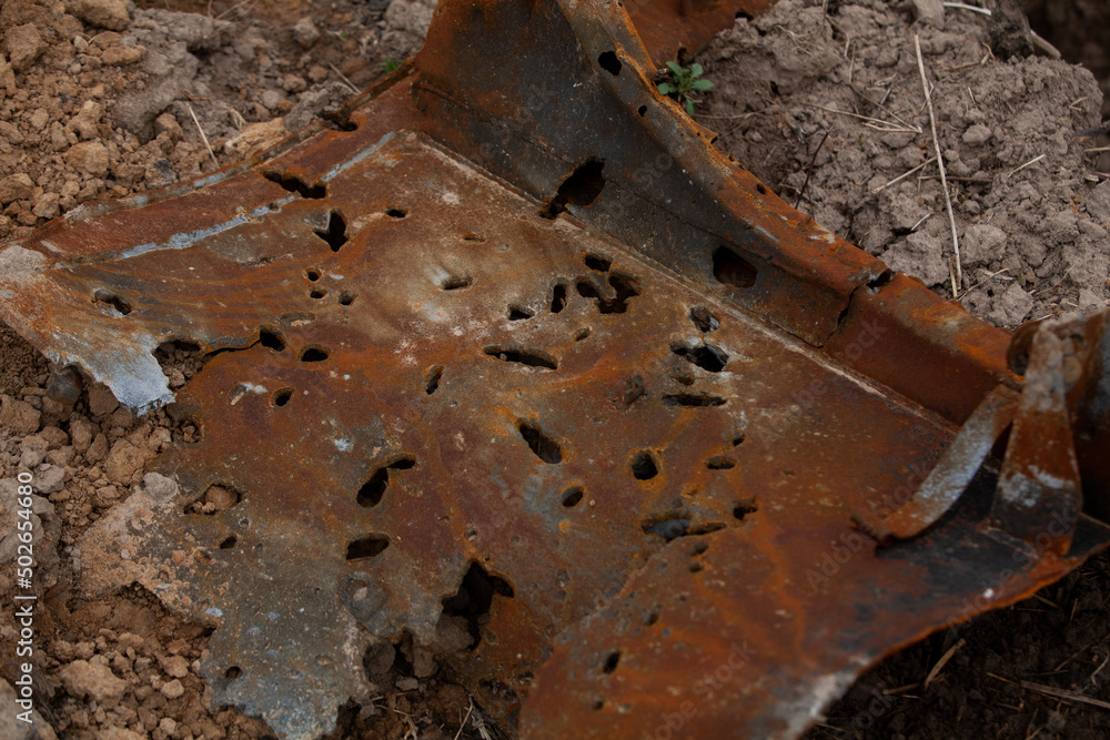 Tank armor pierced by shrapnel Stock Photo | Adobe Stock