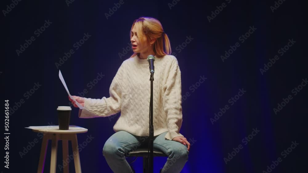 Stand-up cafe, woman comedy concert. Woman telling jokes on stage ...