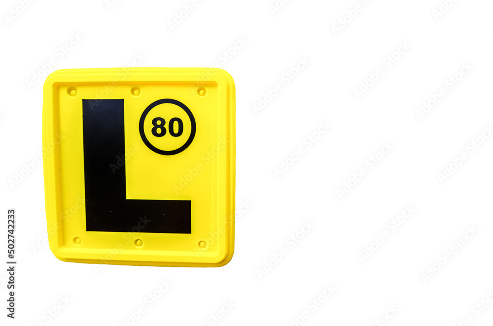 A sans-serif letter "L plate" in yellow color which must be affixed to ...