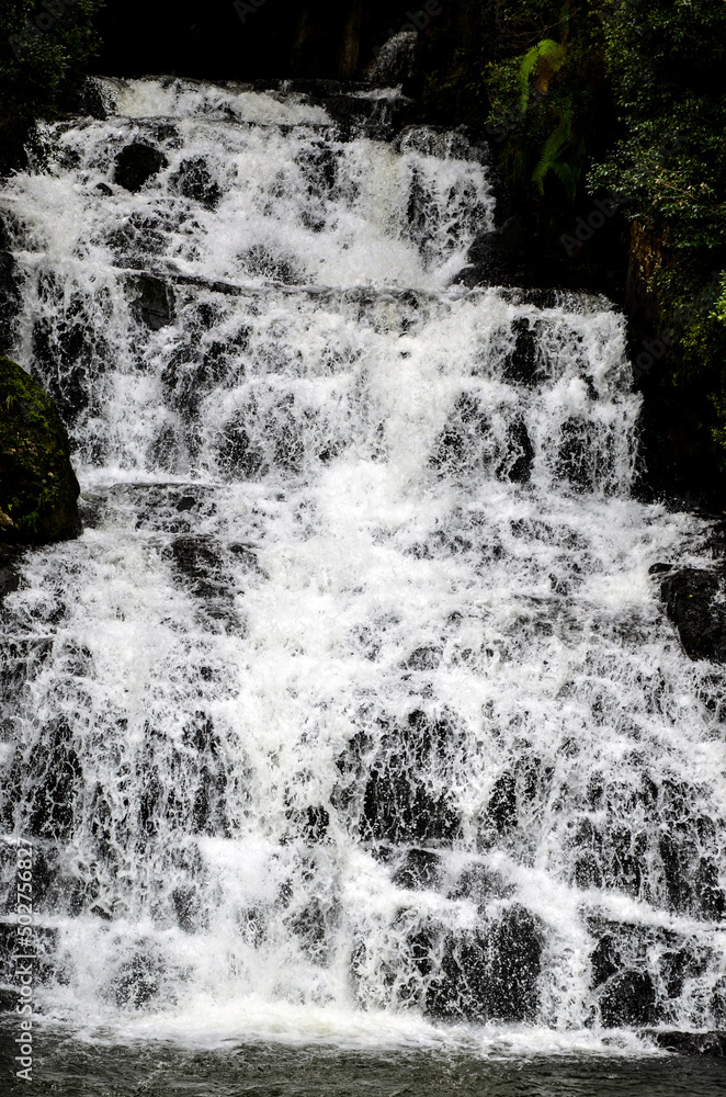 Seamless water flows from the top of the mountain. Beautiful waterfall ...