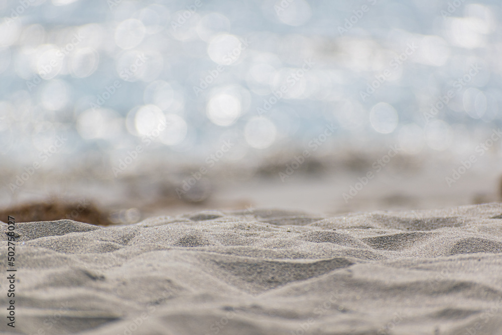 Sparkling little white caps in the light blue ocean waves with light ...