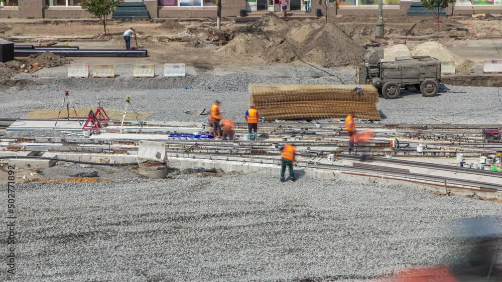 Repair works on the street aerial timelapse. Laying of new tram rails ...