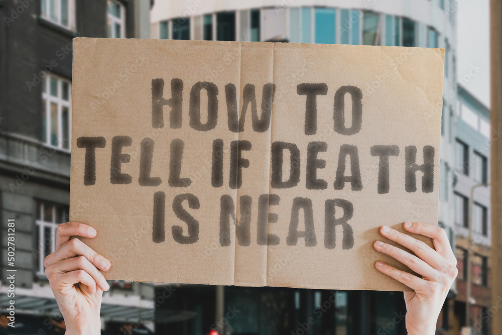 The phrase " How to tell if death is near " is on a banner in men's ...