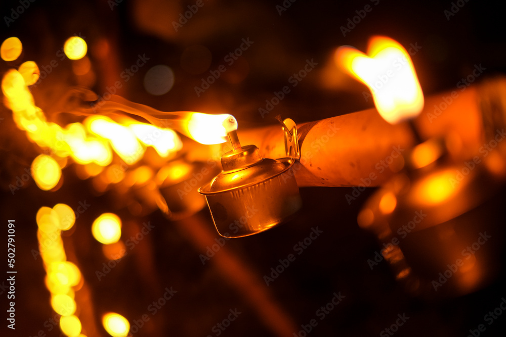 Malay tradition kerosene oil lamp or pelita in selective focus during ...