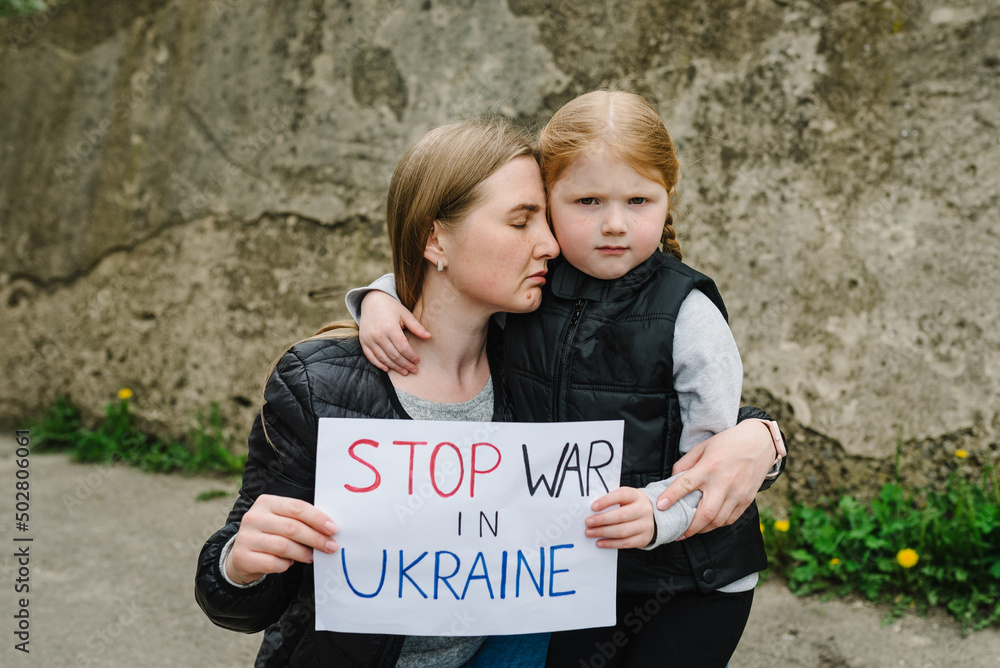 Families against war. Portrait little upset child with mother calls No ...