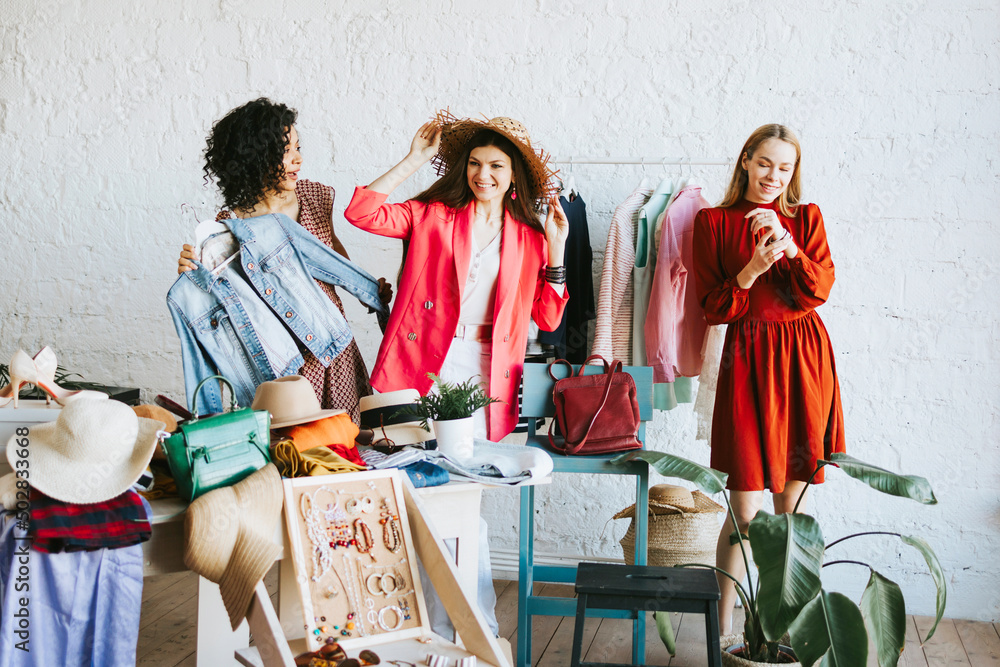 Stockfoto three young woman female caucasian and african students at ...