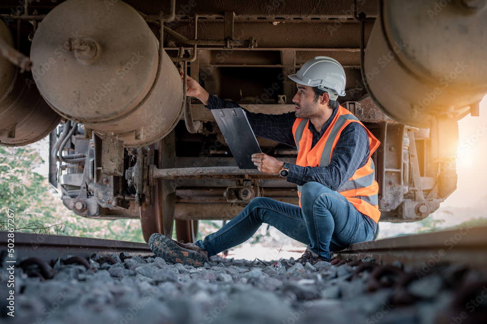 Engineer under inspection and checking construction process railway ...