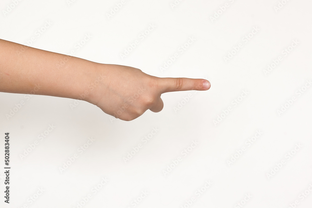 Child's hand showing gesture. The child's hand is holding something ...