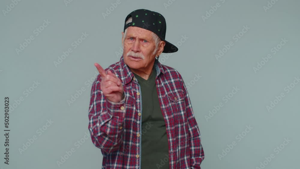 Displeased man shakes finger and saying no, be careful, scolding and ...