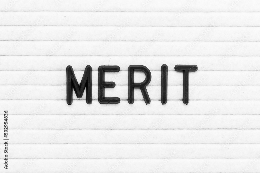 Black color letter in word merit on white felt board background Stock ...
