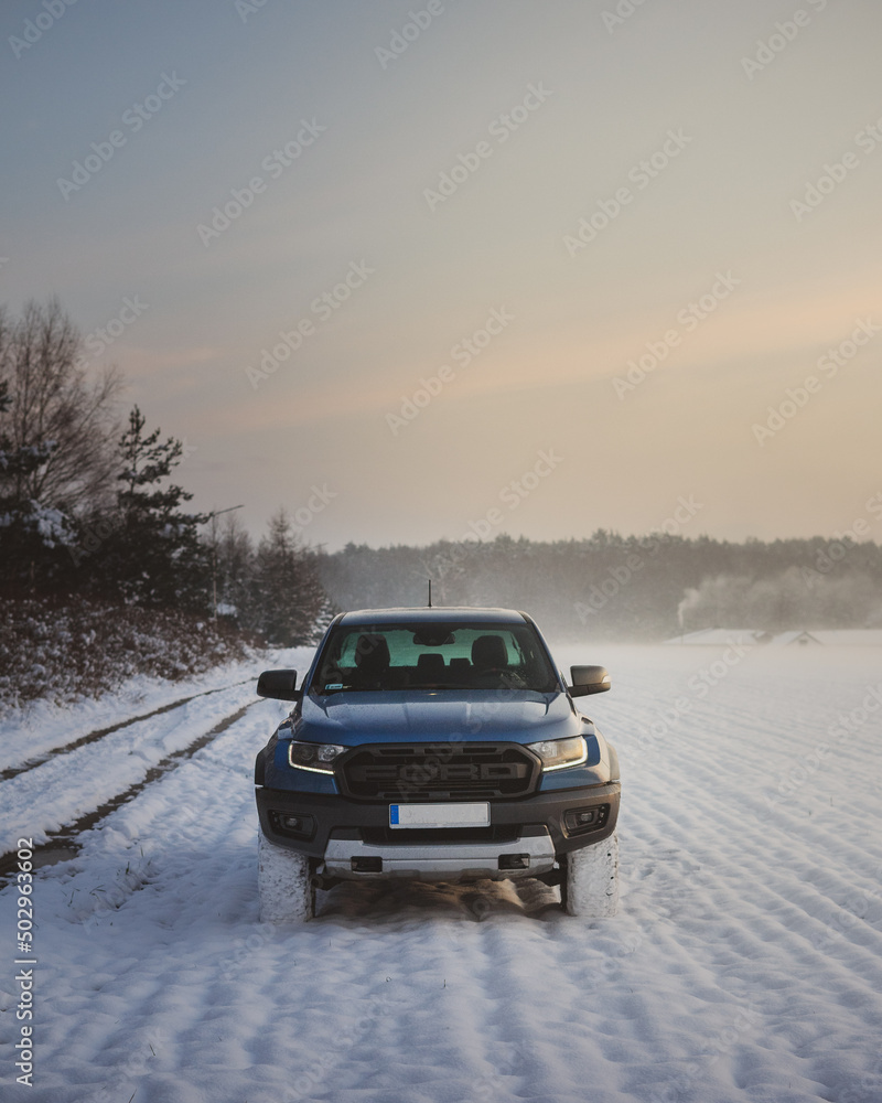 Ford Ranger raptor in the snow at sunset Stock Photo | Adobe Stock