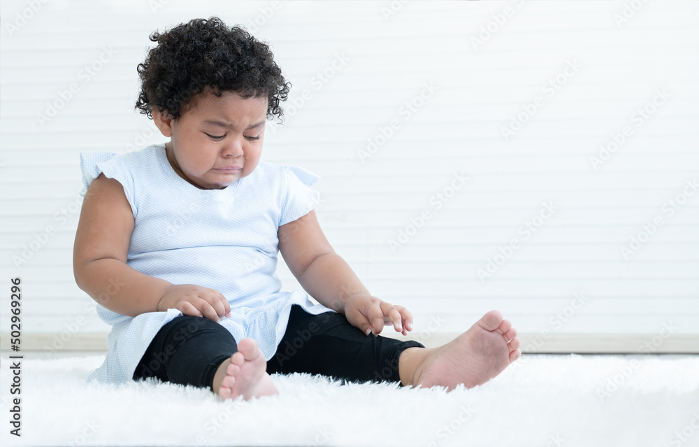 Little pitiful African American chubby kid girl is crying with tears ...