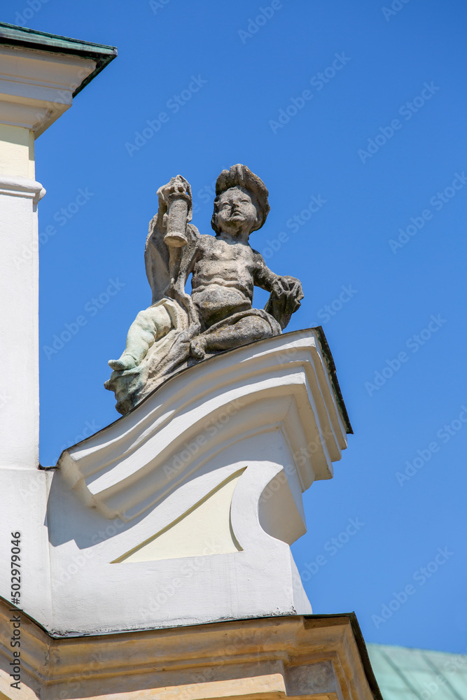 17th century baroque Church of St.Michael the Archangel, statue on the ...