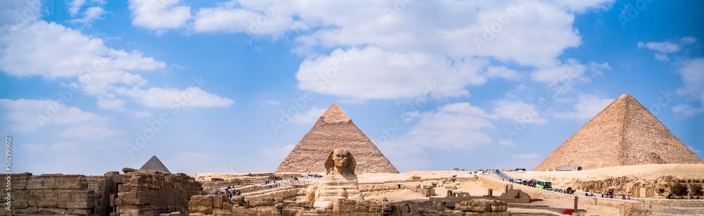 The three pyramids of cairo and the sphinx in a panoramic photograph ...