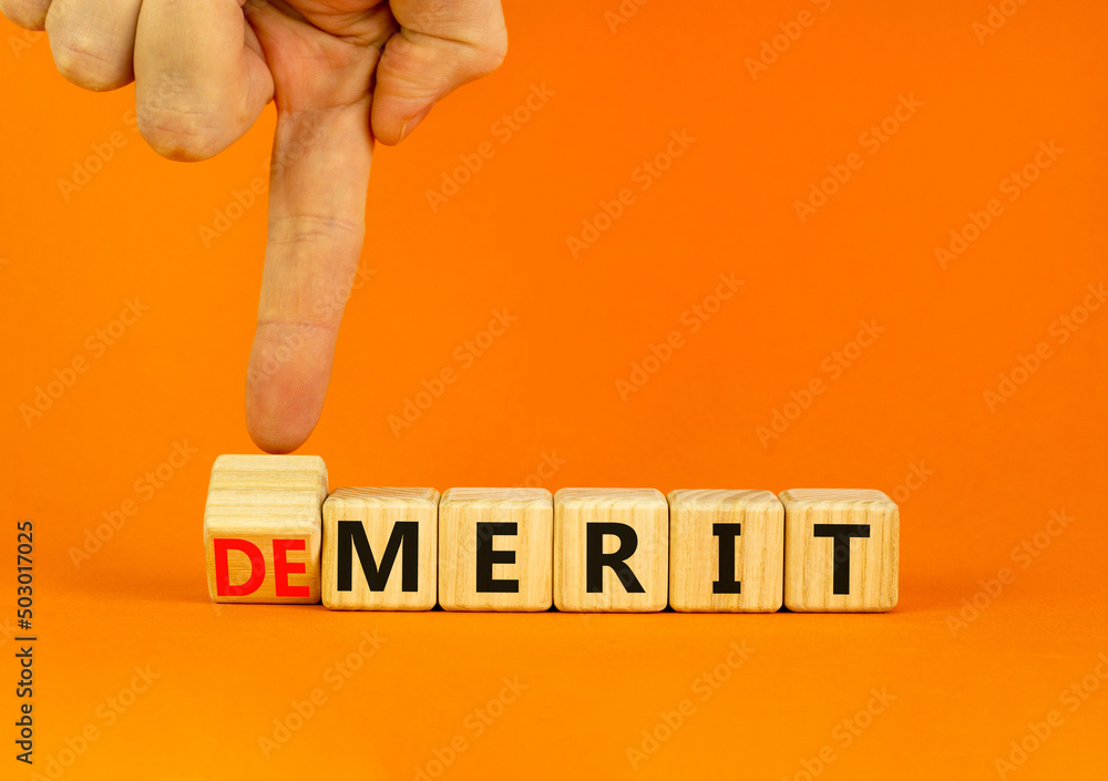 Demerit or merit symbol. Businessman turns wooden cubes and changes the ...
