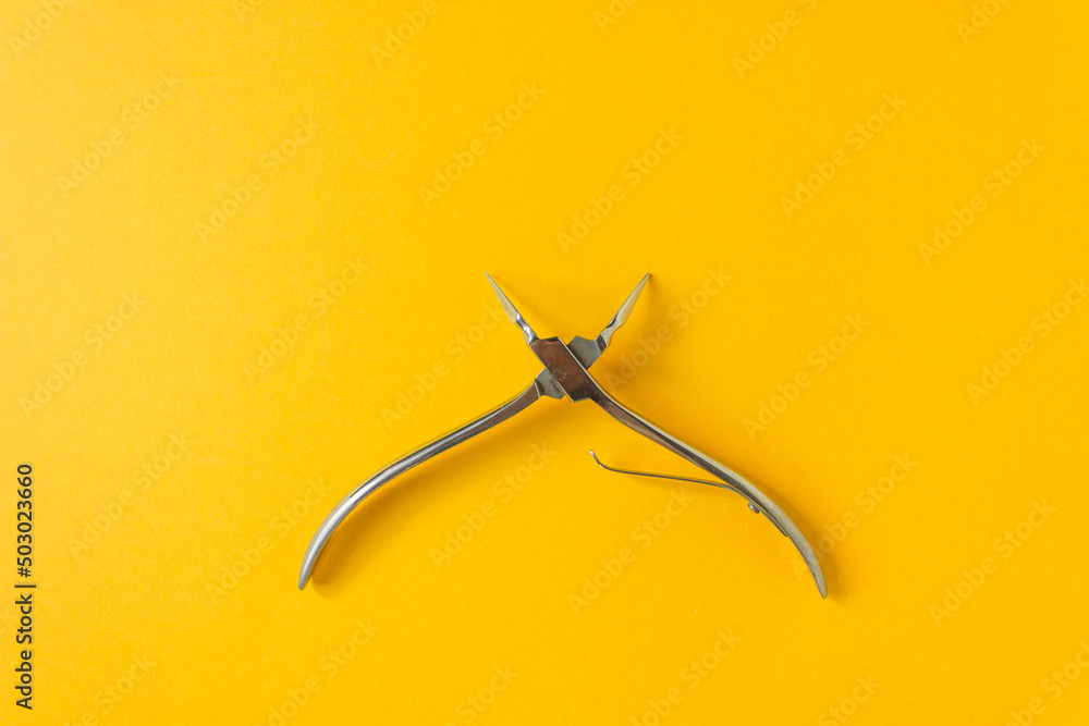 Open dental forceps for removing the root of the tooth isolated on the ...