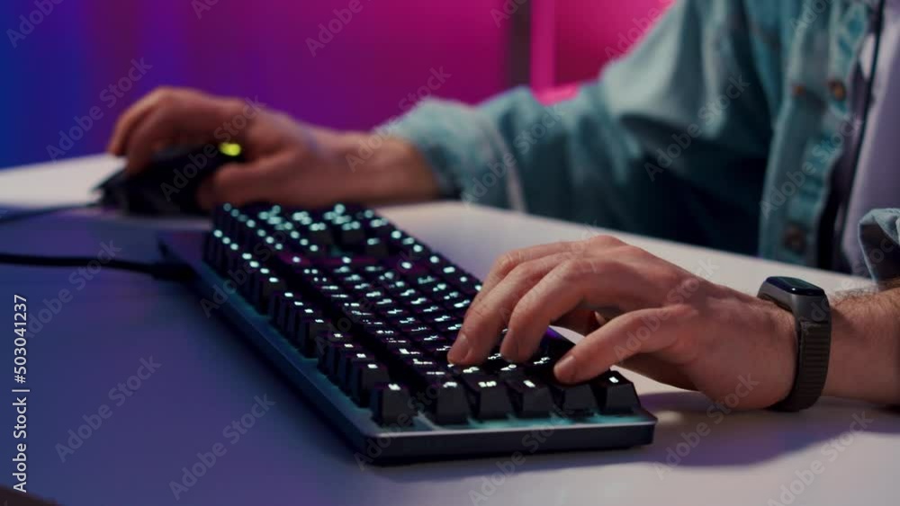 Close-up on Hands man Gamer Playing in Video Game Using Keyboard. Male ...