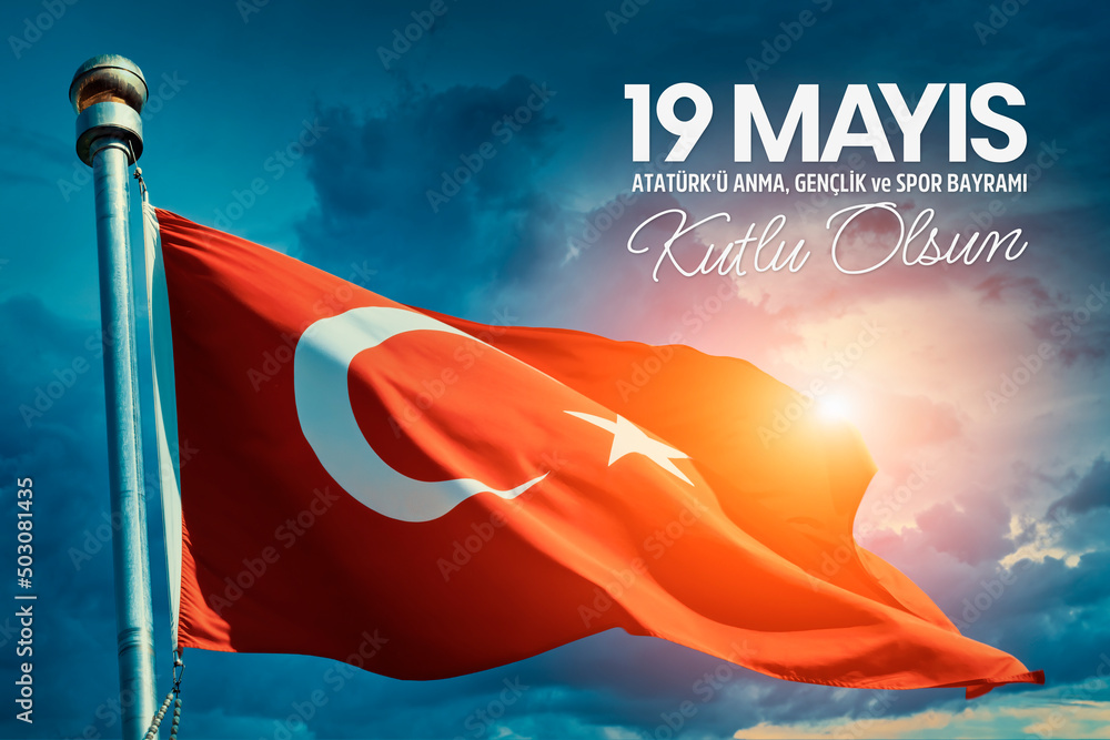 Turkey flag waving in the wind over cloudy sky during sunrise. 19 Mayis ...
