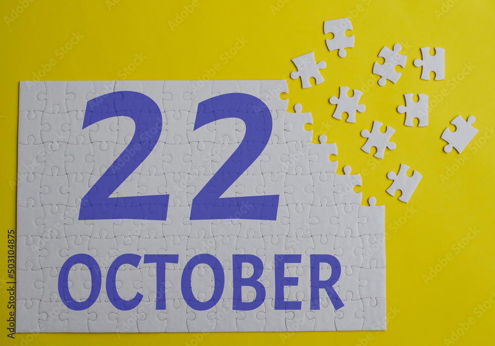 22 october calendar date on a white puzzle with separate details ...