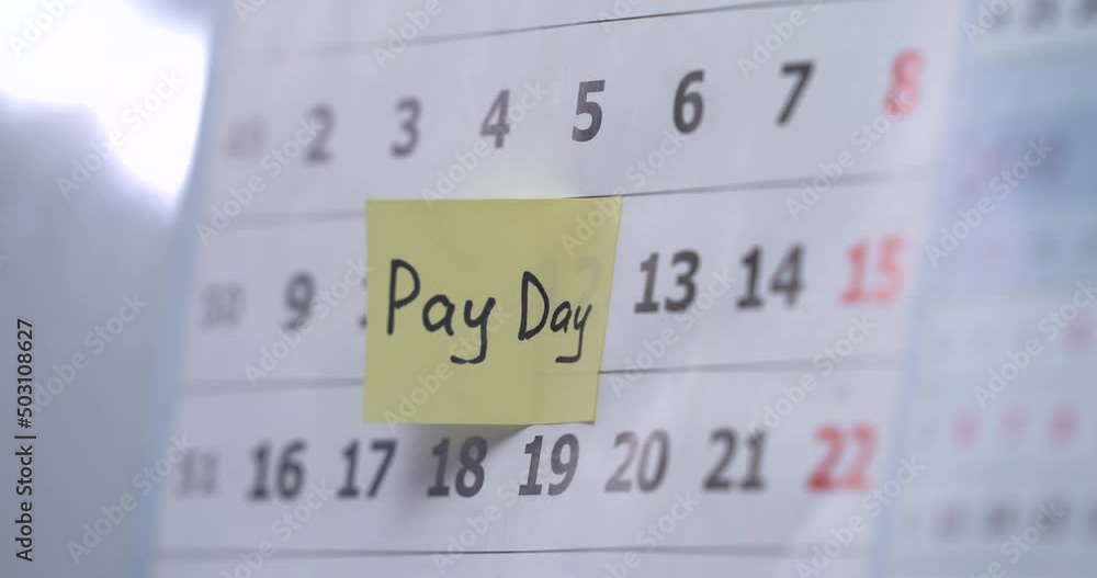 Signing a payment day in calendar 2022. Business and finance concept ...