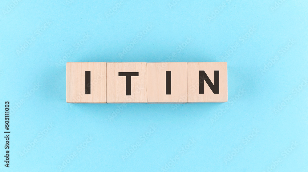 Wooden cube block with text ITIN - Individual Taxpayer Identification ...