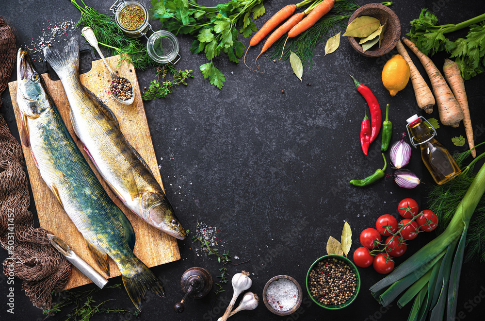 Fresh raw pike perche or zander and pike fish with ingredients prepared ...