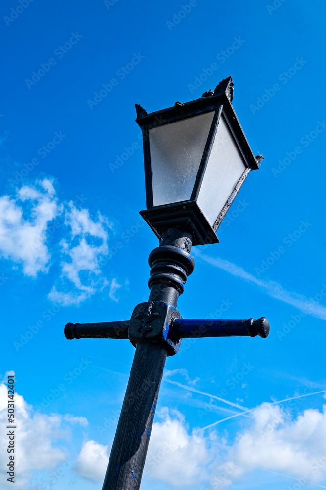 Poster Victorian style street light isolated against deep blue sky ...