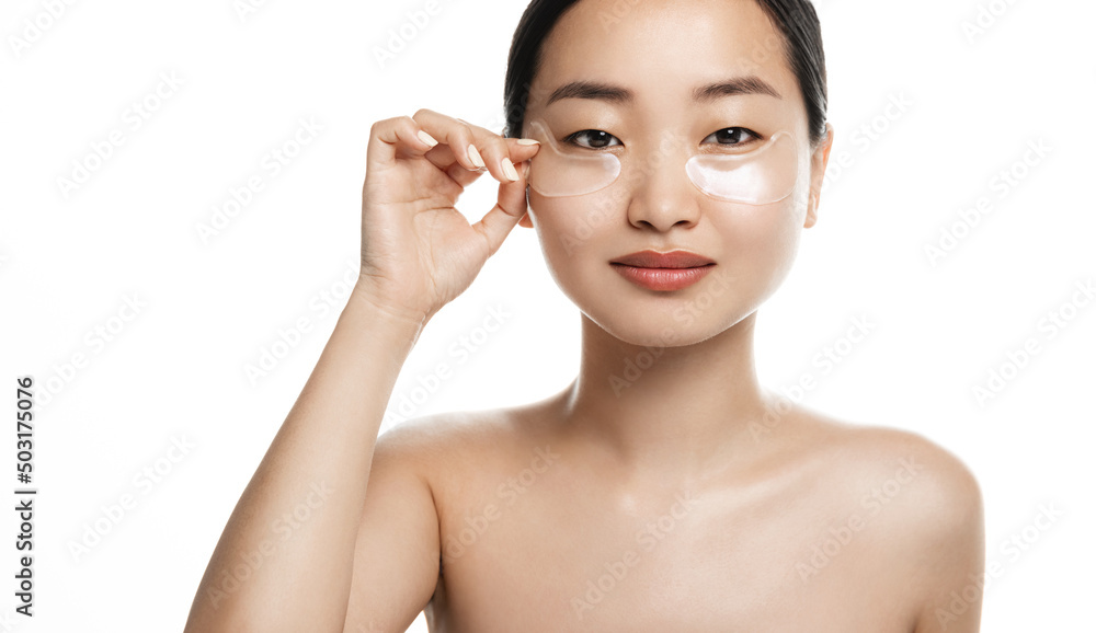 Close up of asian woman face with under eye patches from dark-circles ...